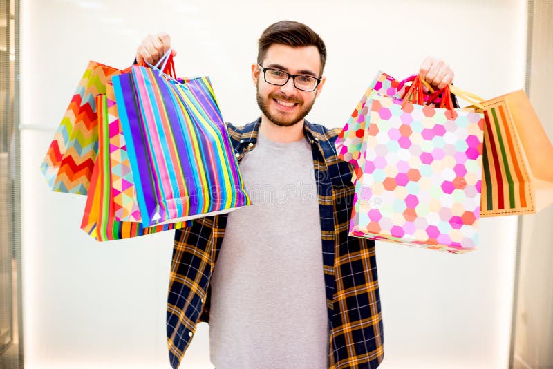 Guy shopping in a mall stock image. Image of consumerism - 94690405