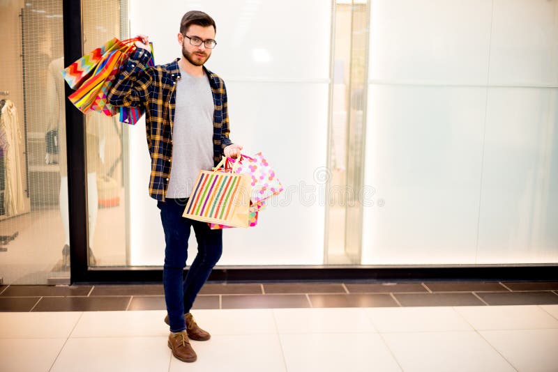 Guy shopping in a mall stock image. Image of male, fashion - 94691447