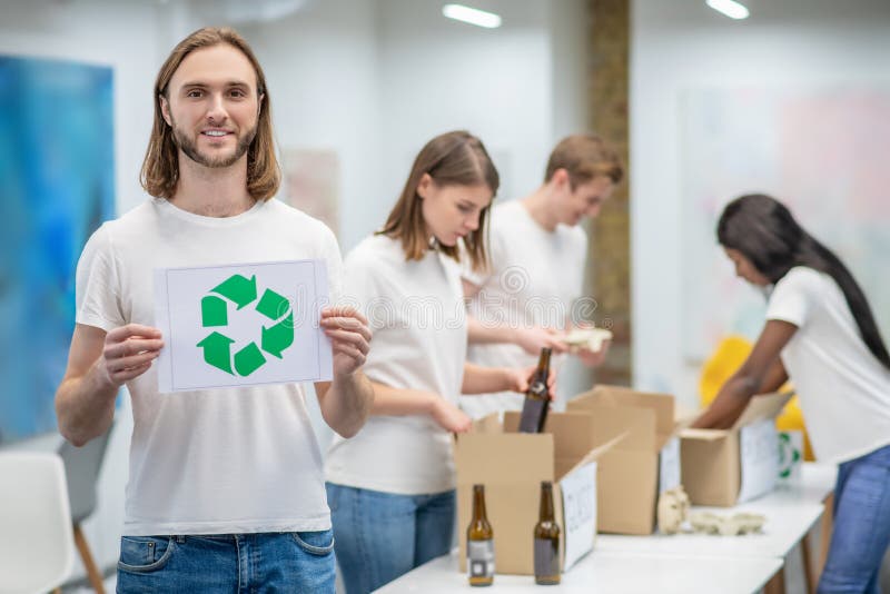 Guy with Sign of Processing Raw Materials in Hands Stock Photo - Image ...