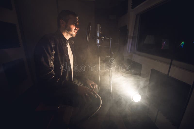 Guy Singing with a Mic on a Stage. Musician and Singer Stock Photo ...