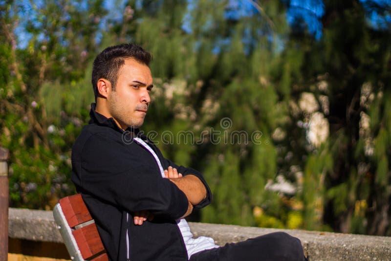 Man on a park bench stock photo. Image of dude, greenery - 86126220