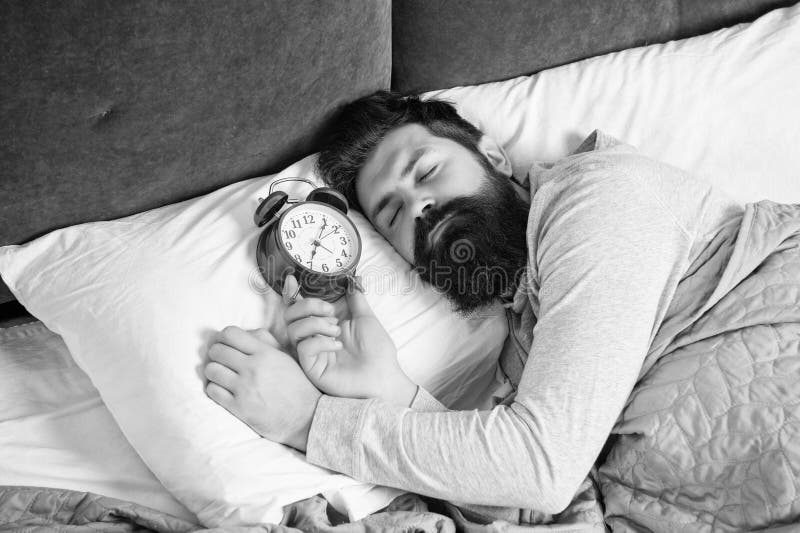 Guy Sleeping with Alarm Clock in Bed, Sleep Time Stock Photo - Image of ...
