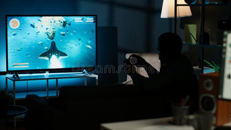 Guy Spends Time on Television Playing Multiplayer Web Video Games Stock ...