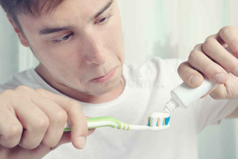 Toothpaste and toothbrush stock photo. Image of lean - 98875924