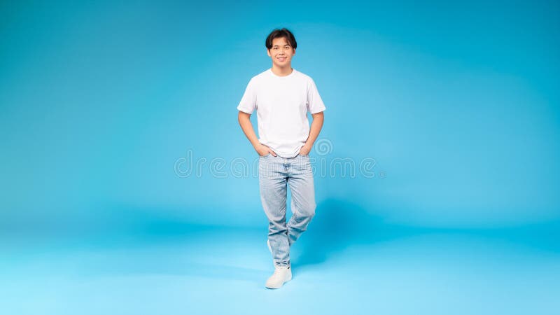 Guy Standing in Front of Blue Background Stock Photo - Image of plain ...