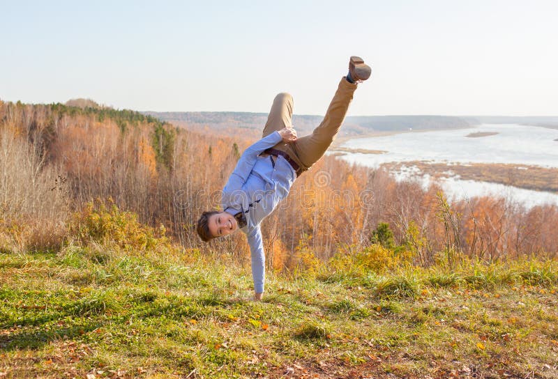 Guy standing on one hand stock photo. Image of people - 60918846