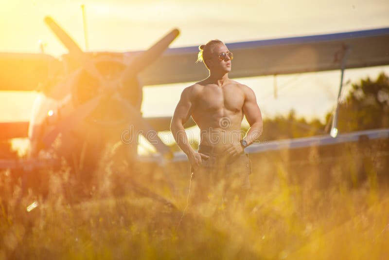 A Guy is Standing by the Plane. Stock Image - Image of body, macho ...