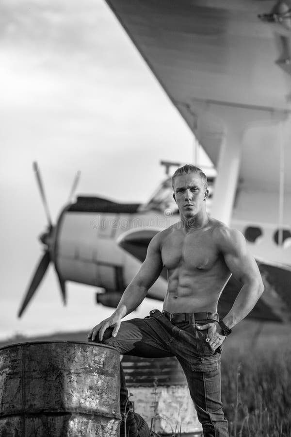 A Guy is Standing by the Plane. Stock Image - Image of pilot, muscle ...