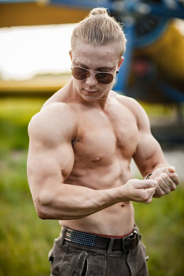 A Guy is Standing by the Plane. Stock Photo - Image of attractive ...