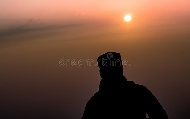 Guy Staring into Sunset on Top of Mountains Stock Image - Image of ...