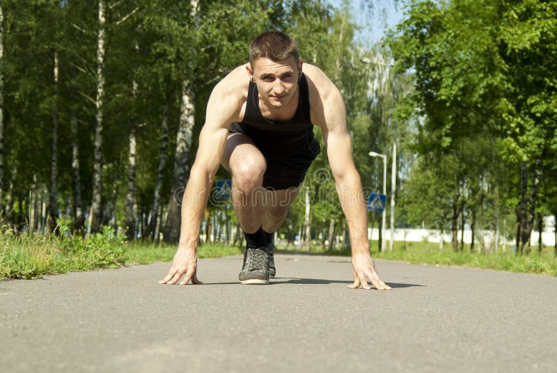 Guy starts at the track stock image. Image of health - 26309437