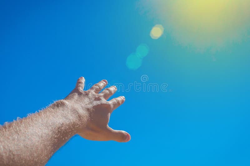 The Guy Stretched His Hand Forward Towards the Blue Sky and the Sun ...