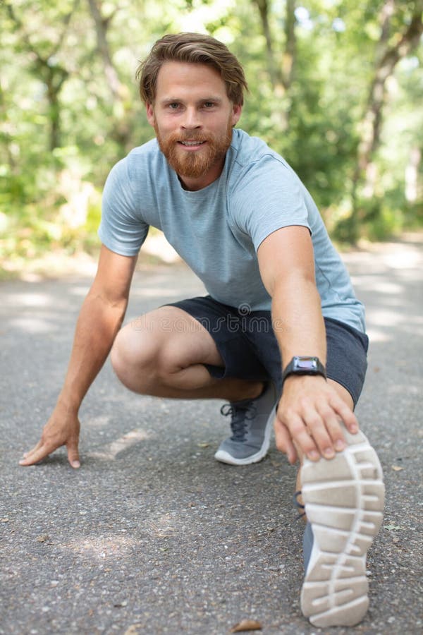 Guy Stretching Legs during Warming-up for Jogging Stock Image - Image ...