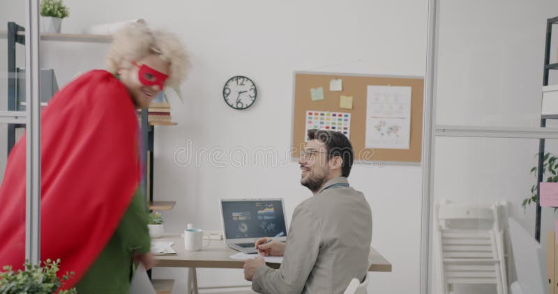 Active Guy in Super Hero Costume Helping Office Workers while People ...
