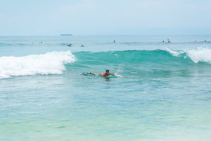 The Guy is Swimming on the Surf Board on the Ocean. Healthy Active ...