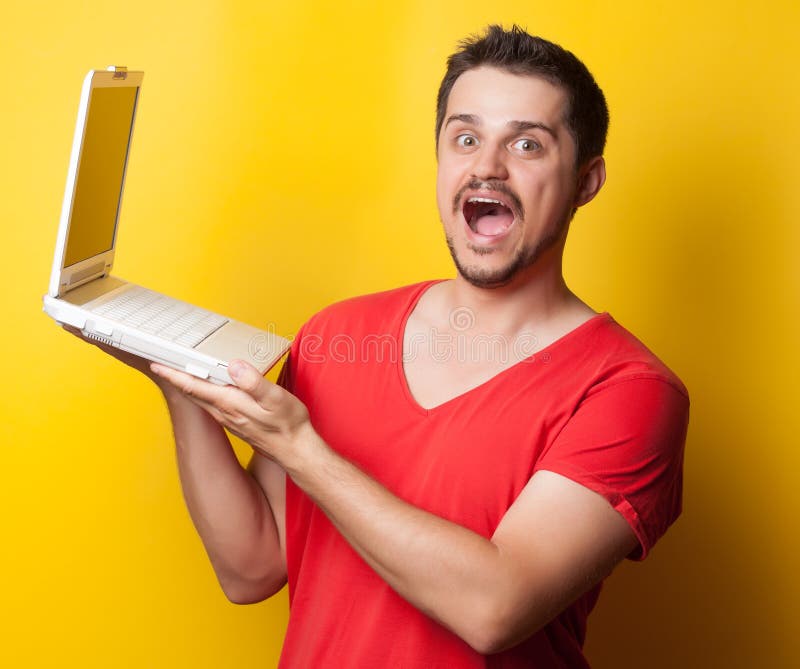 Guy in T-shirt with Laptop Computer Stock Photo - Image of stubble ...