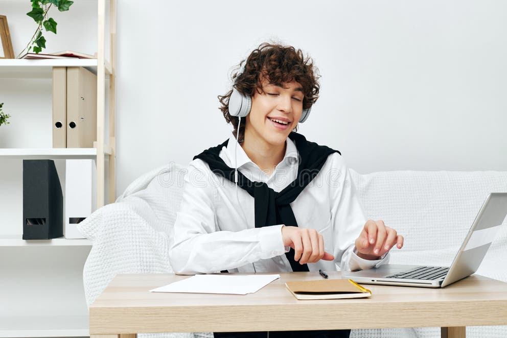 Guy at the Table in Front of a Laptop Learning Lifestyle Technology ...