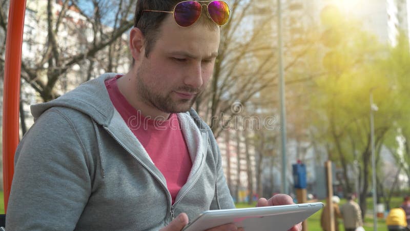 Guy with Tablet Computer at Sport Ground Stock Footage - Video of ...