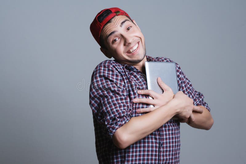 Guy with a Tablet in a Studio on a Gray Background Stock Photo - Image ...