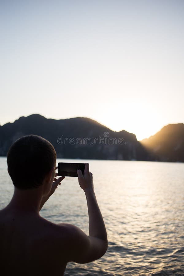 Guy Takes Pictures on Beach Stock Image - Image of beach, smartphone ...