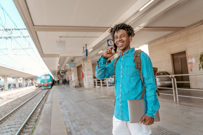 Guy Talking on Smartphone Waiting on Railway Platform Stock Image ...