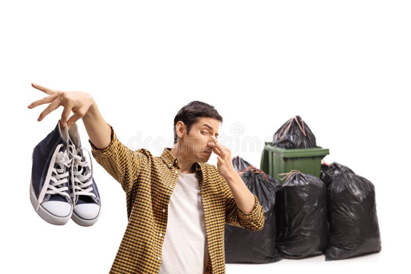 Man Throwing a Pair of Smelly Shoes in the Garbage Stock Image - Image ...