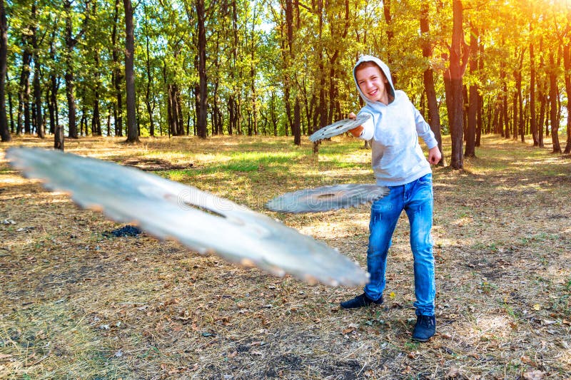 The Guy Throws a Circular Knife To Attack the Enemy in the Forest ...