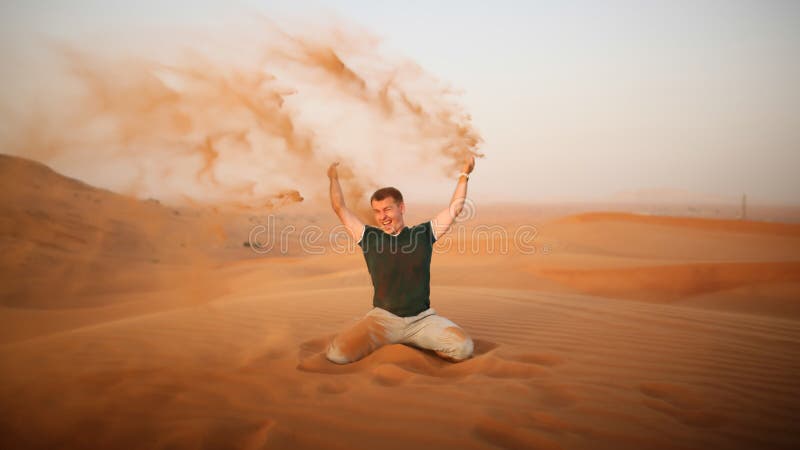 The Guy Throws Sand Over Himself in the Desert. the Desert is Next To ...