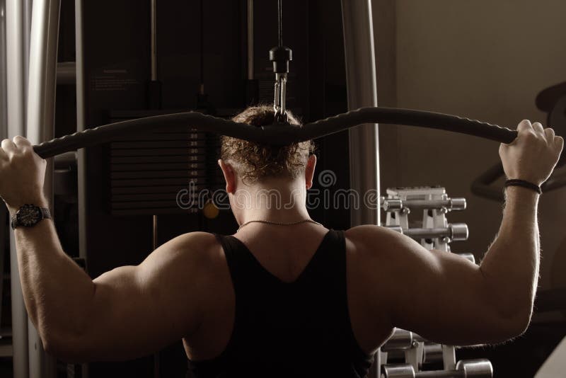 Guy training back muscles stock image. Image of fitness - 10613405