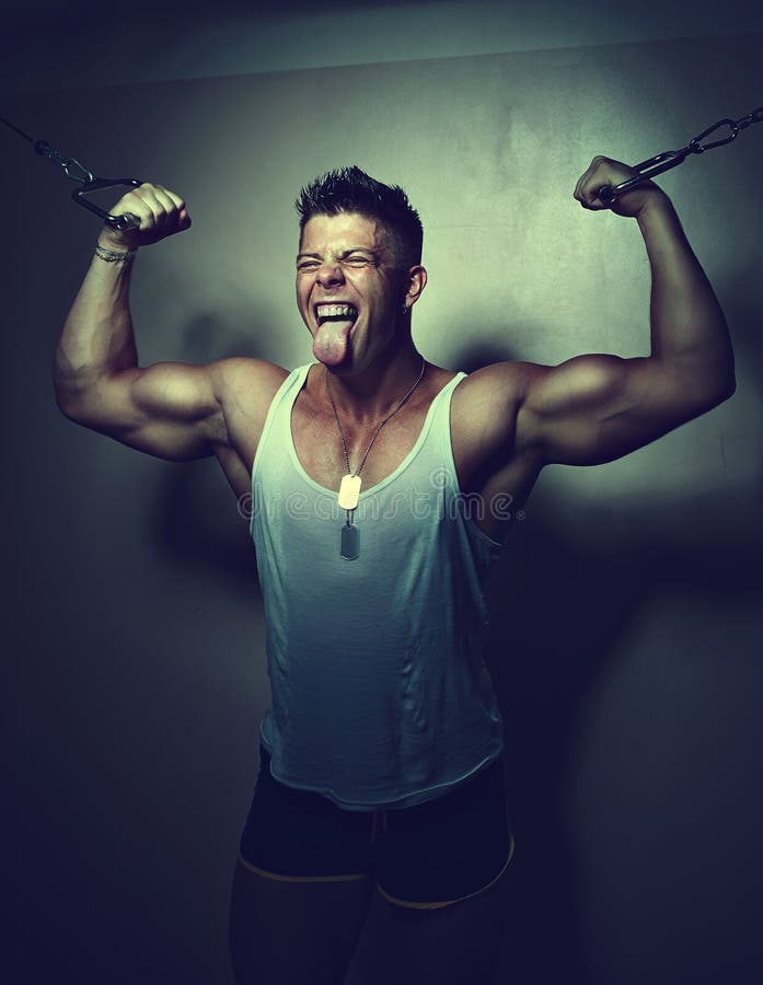 Guy Trains His Pecs Using Crossover Stock Image - Image of handsome ...
