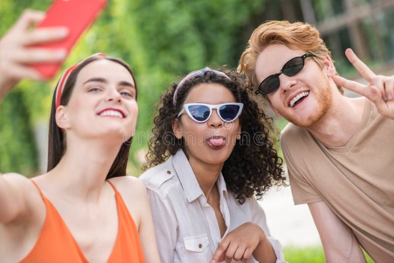 Guy And Two Girls Taking Selfie On Smartphone Stock Image Image Of