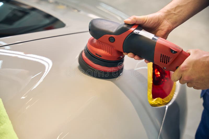 Guy Uses a Modern Polishing Machine in the Detailing Process Stock ...