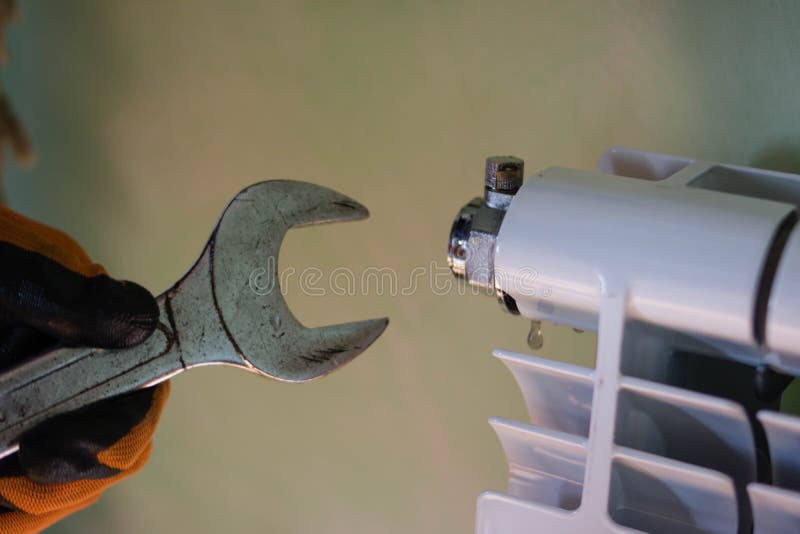 Guy Uses a Wrench To Change the Radiator Broken Air Vent Stock Image ...