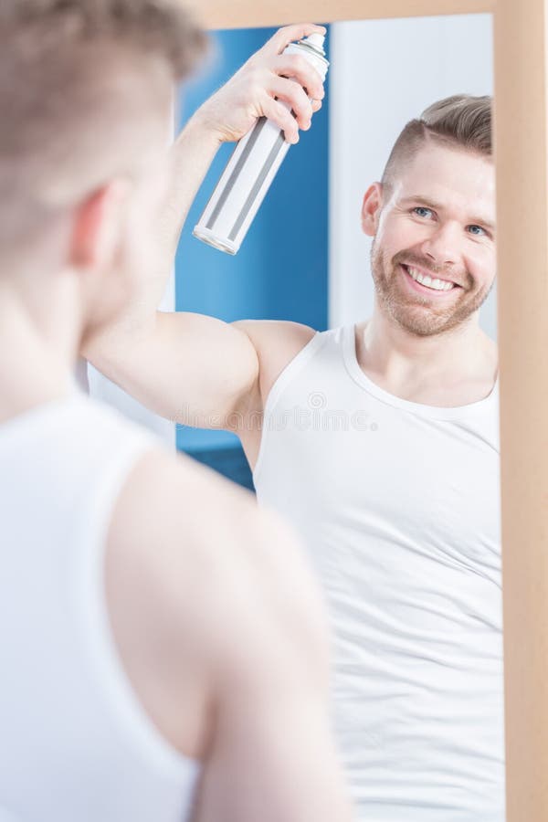 Guy using hair spray stock photo. Image of face, handsome - 62619312
