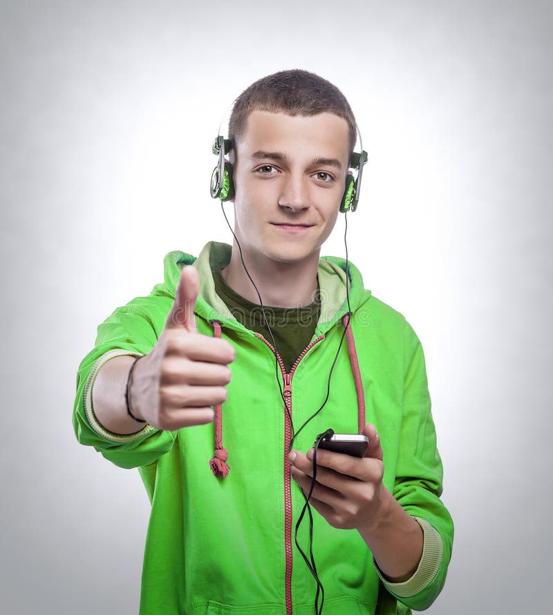 Guy Using Phone with Headphones Stock Image - Image of head, hair: 82787193