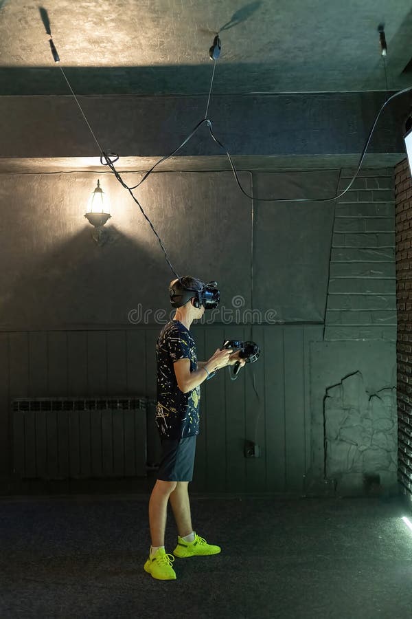 The Guy in the VR Helmet Plays Computer Games Stock Photo - Image of ...