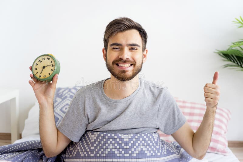 Guy is waking up stock image. Image of morning, alarm - 100314599