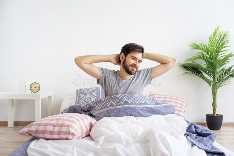 Guy is waking up stock image. Image of happy, stretch - 100314667
