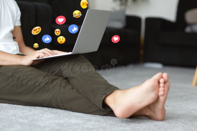 Guy Watching a Social Media Live Stream on a Computer at Home Stock ...