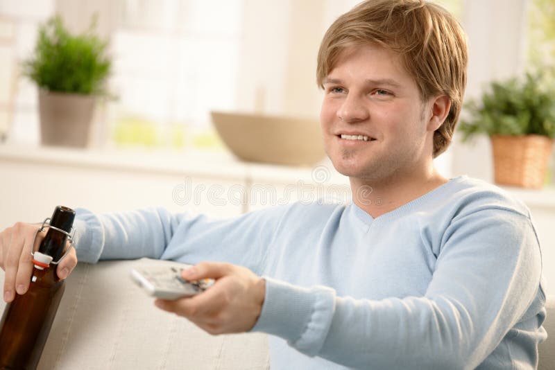 Guy watching tv stock image. Image of enjoying, caucasian - 19674225