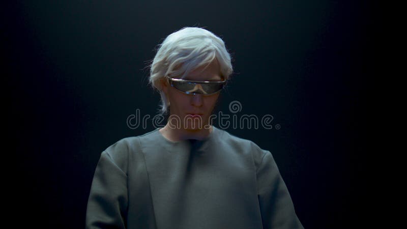 Guy Wearing Futuristic Goggles in Light Closeup. Futuristic Player ...