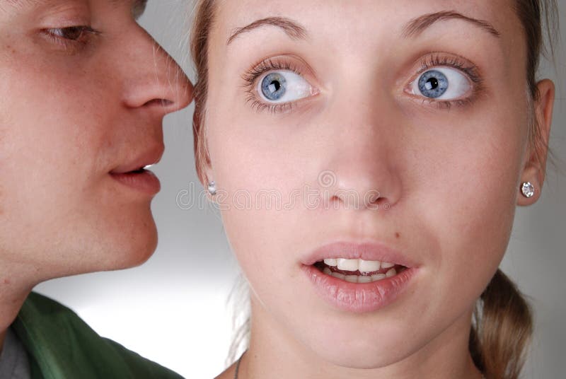 A Guy Whispering Something To a Girl Stock Image - Image of smile ...