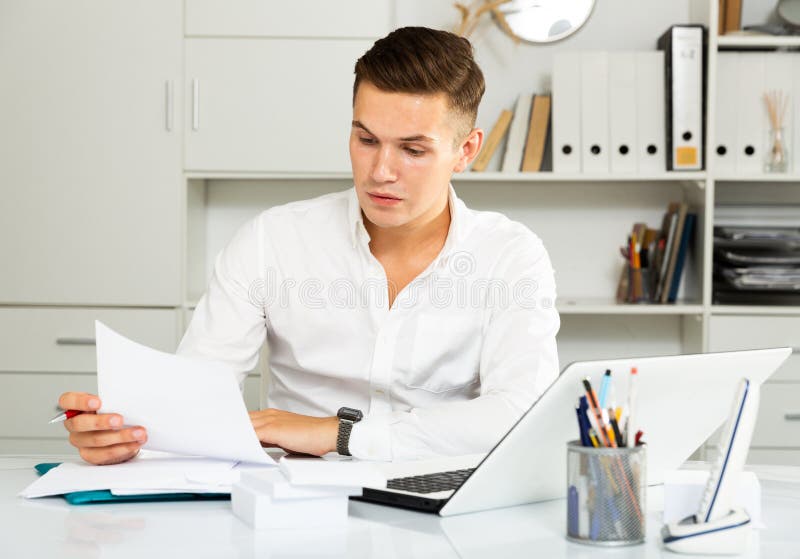 Guy in White Shirt Works at Table with Laptop in Office Stock Image ...