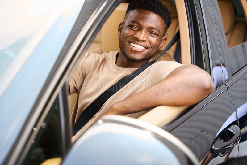 Guy with a White-toothed Smile Sits in the Drivers Seat Stock Photo ...