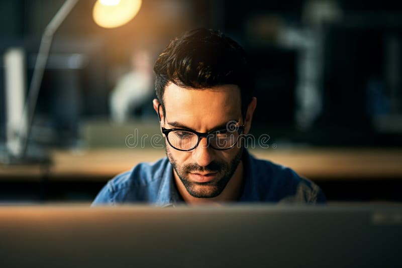 It Guy Working with Computer Late at Night, Searching Online while ...