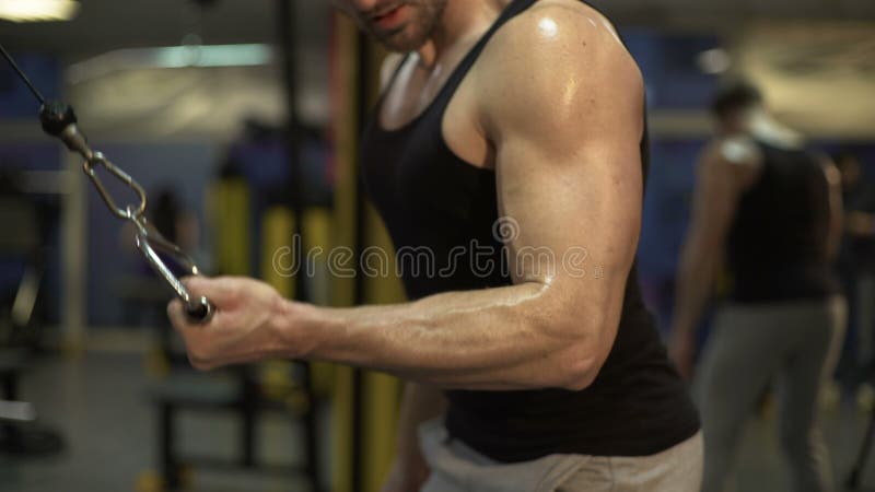 Guy Working Hard in Gym Doing Brisk Pull-downs with One Arm, Finishing ...