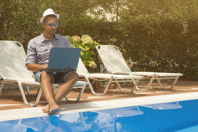 Working on Laptop from the Swimming Pool. Stock Photo - Image of ...