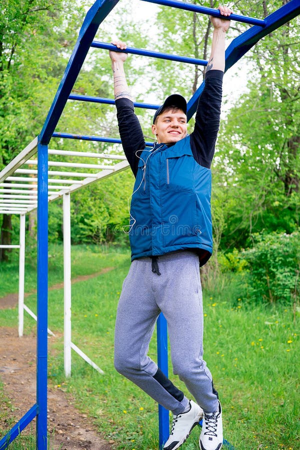 Guy working out outside stock image. Image of playground - 102396589