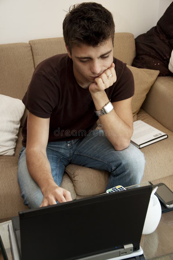 Guy Works with Laptop at Home Stock Image - Image of laptop, couch ...