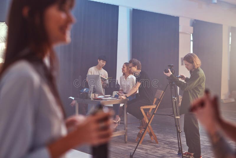 Guy Writing Notes of Producers Near Photographer Stock Image - Image of ...